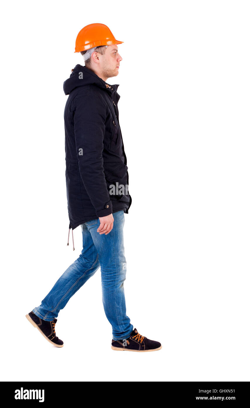 Back view of walking engineer in helmet Stock Photo - Alamy