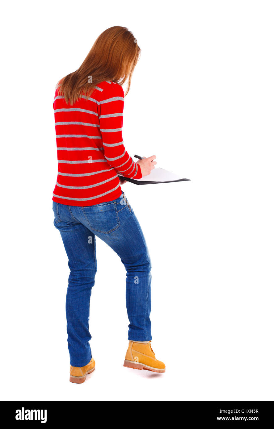 back view of stands woman takes notes in a notebook Stock Photo - Alamy