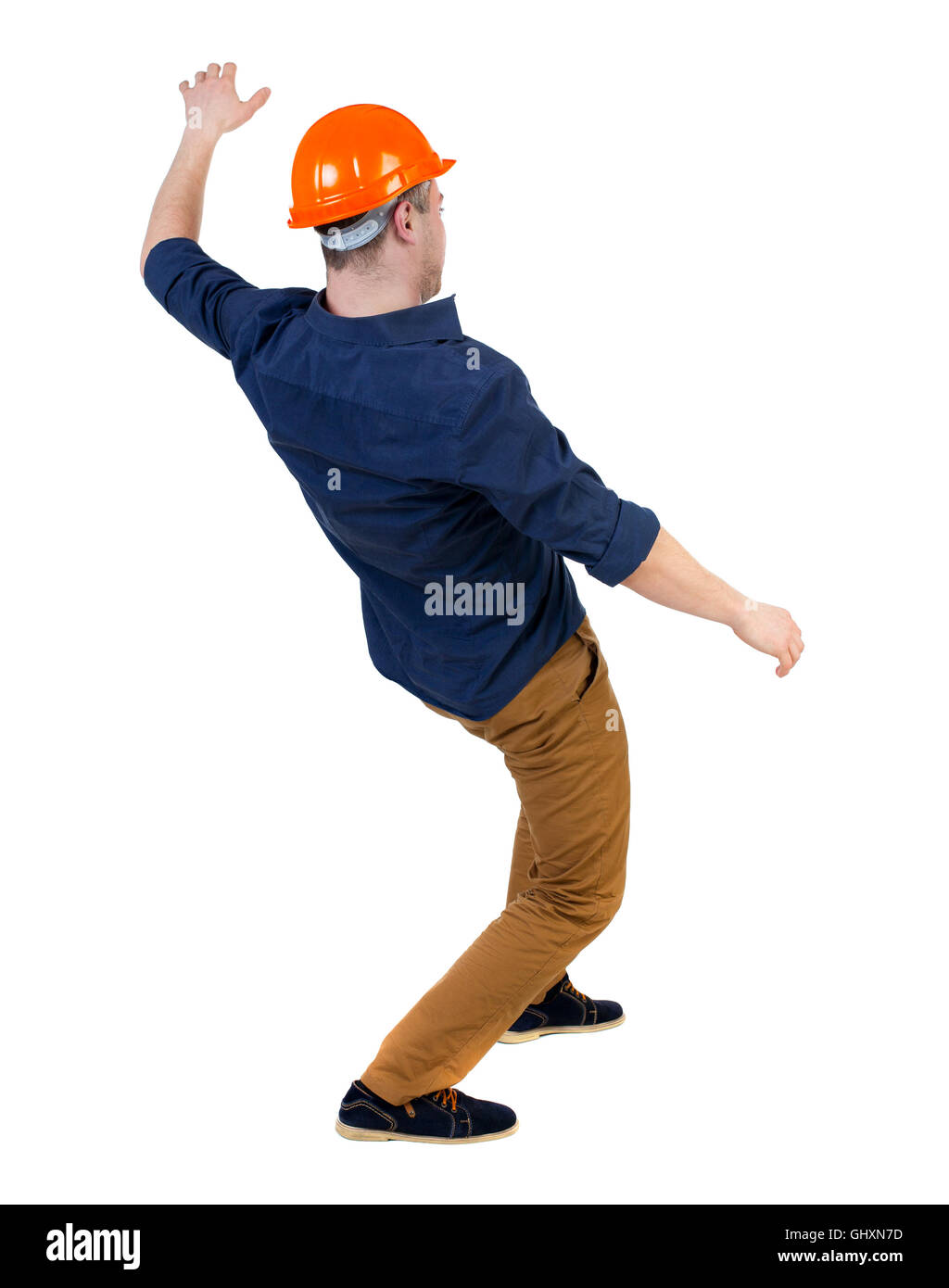 Balancing young man. or dodge the falling Stock Photo - Alamy