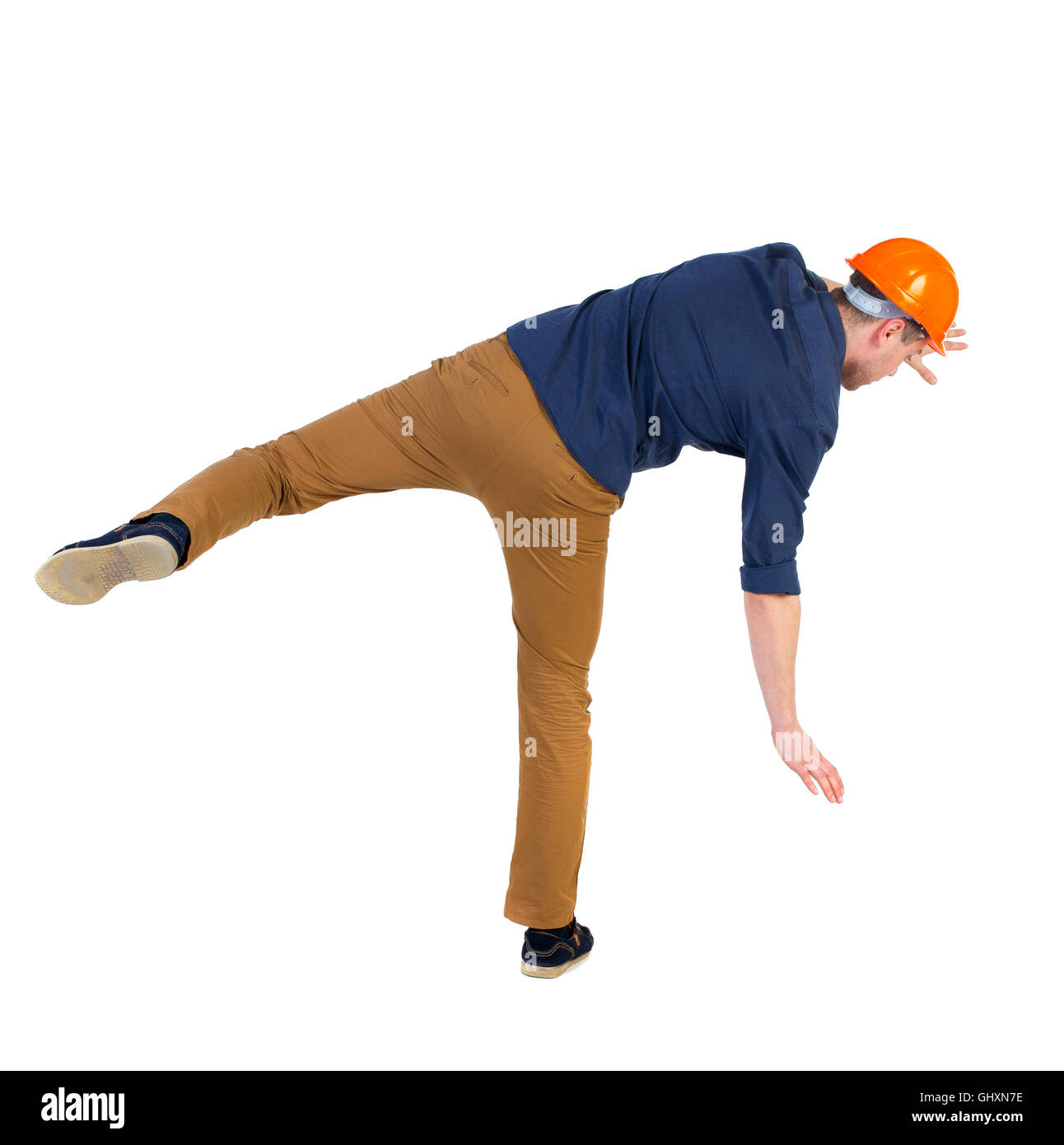 Balancing young man. or dodge the falling Stock Photo - Alamy