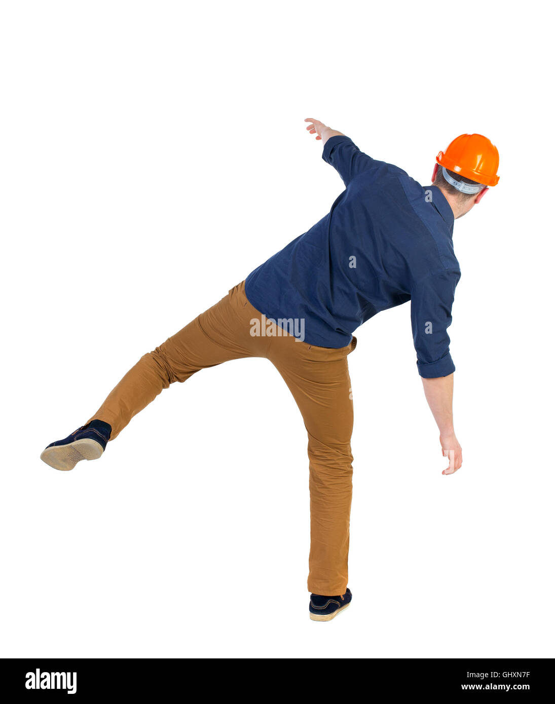 Balancing young man. or dodge the falling Stock Photo - Alamy