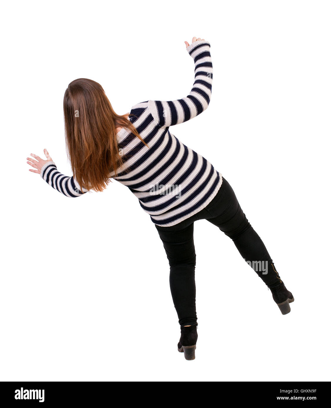 Balancing young woman Stock Photo - Alamy