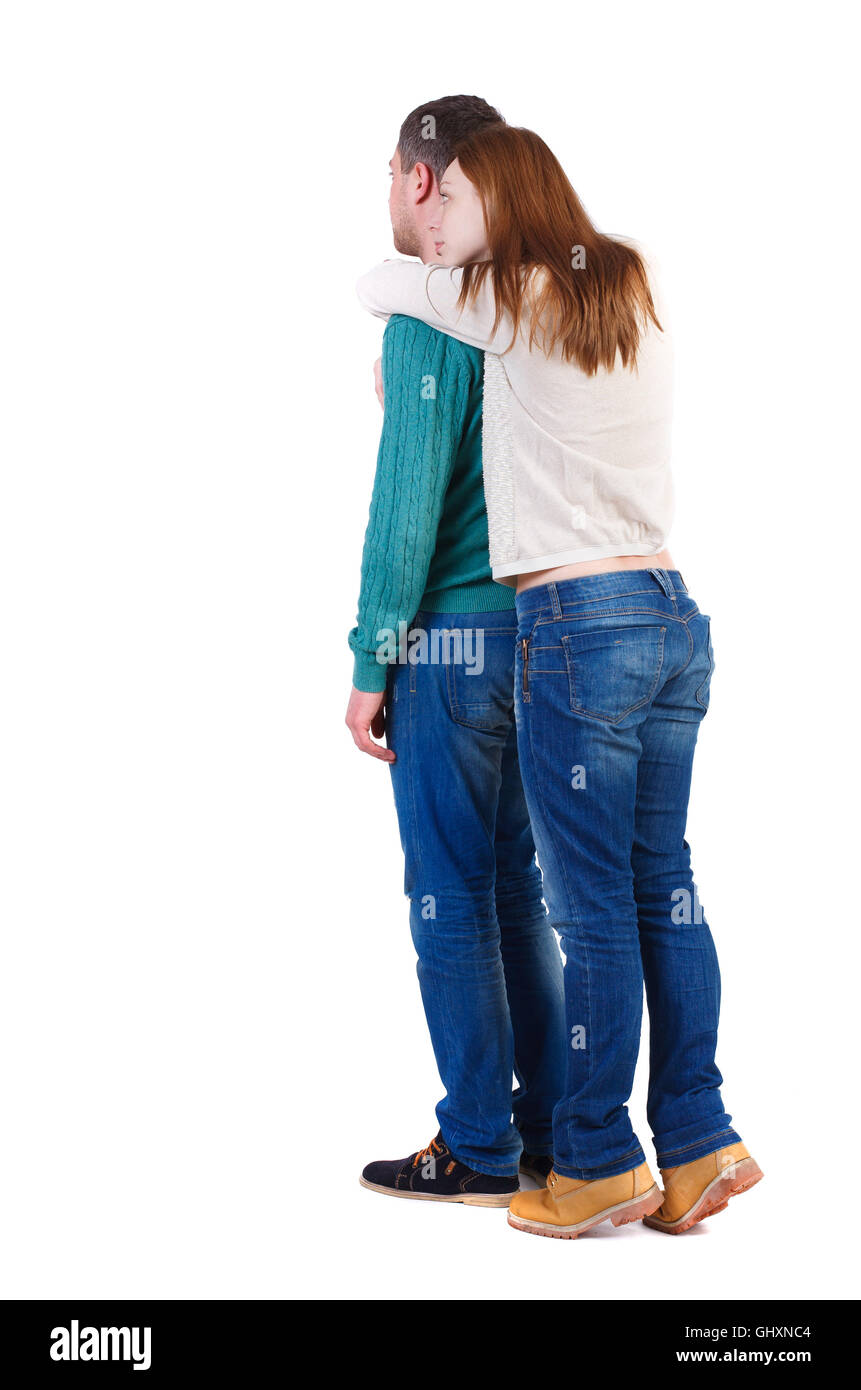 Back view of young embracing couple hug and look Stock Photo - Alamy