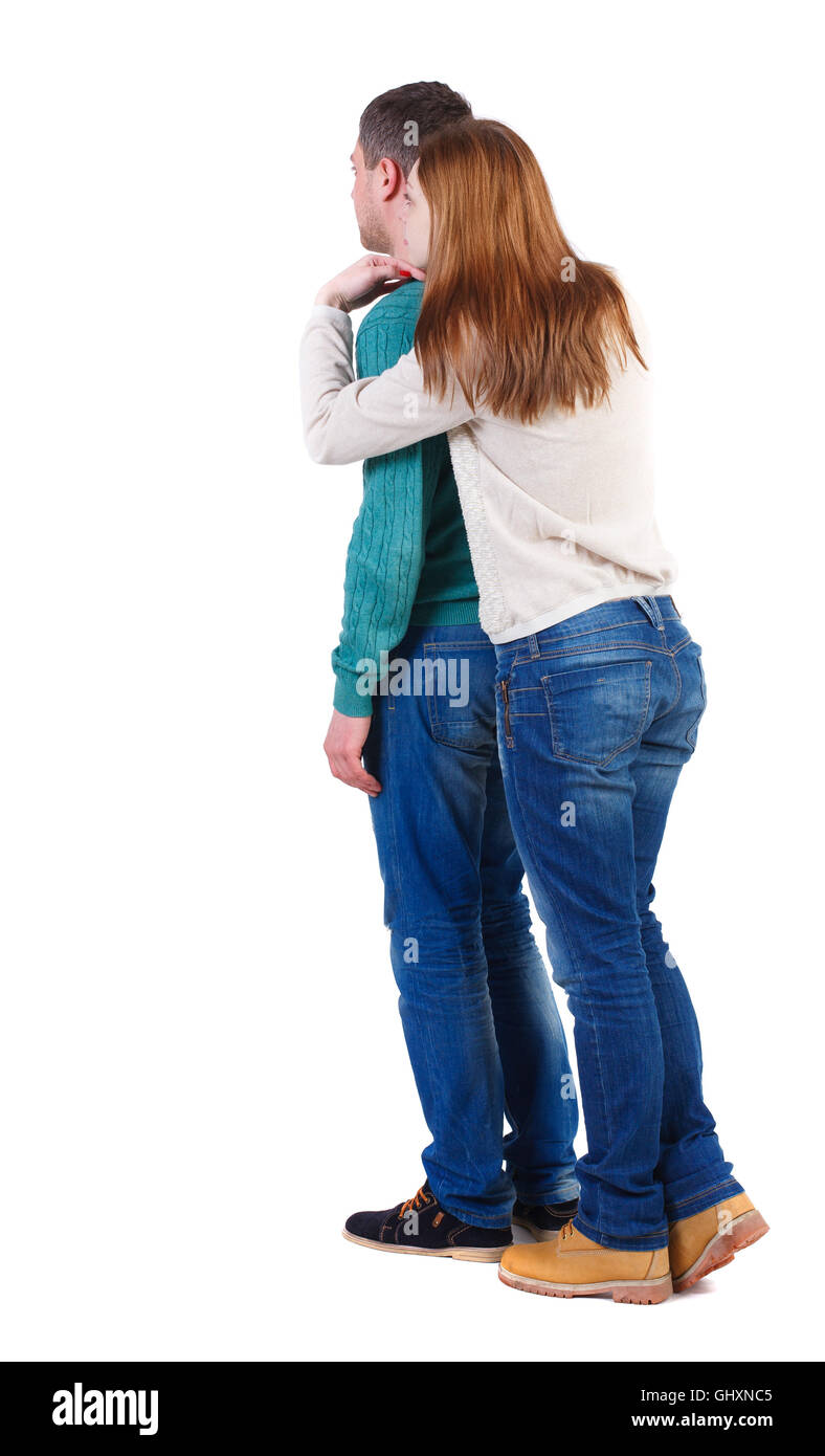 Back view of young embracing couple hug and look Stock Photo - Alamy