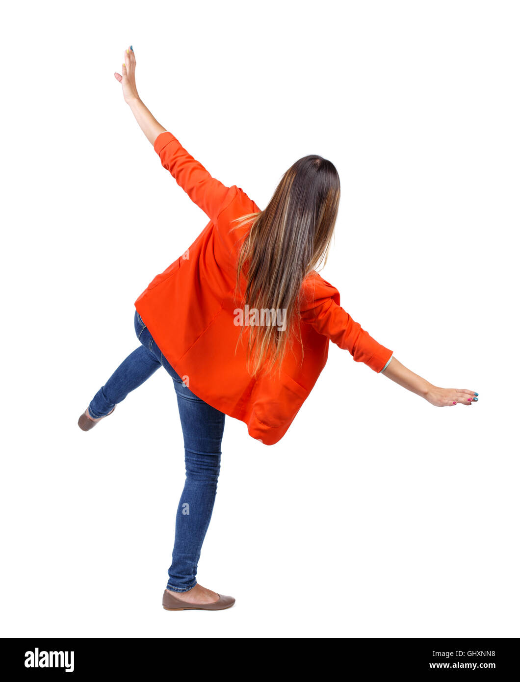 Balancing young woman Stock Photo - Alamy