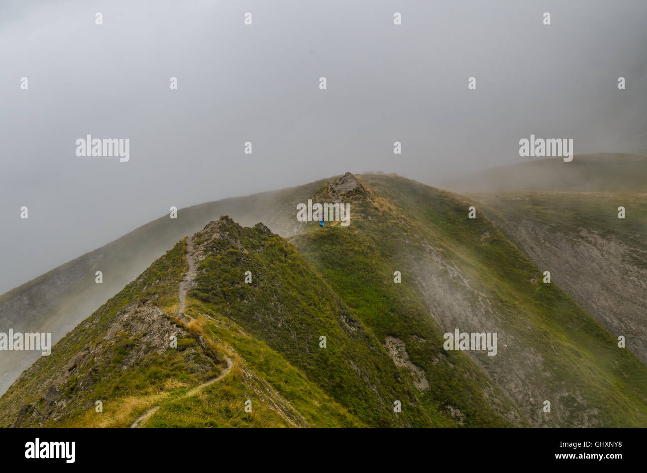 Female trailrunning in the foggy mountains of Lechtal Alps, North Tyrol ...