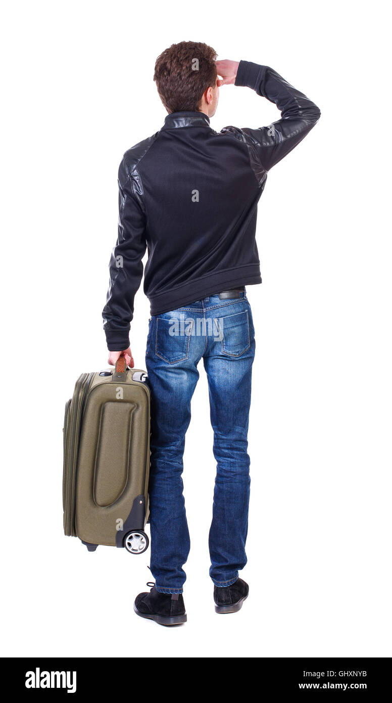 Back view of man with green suitcase looking up Stock Photo - Alamy