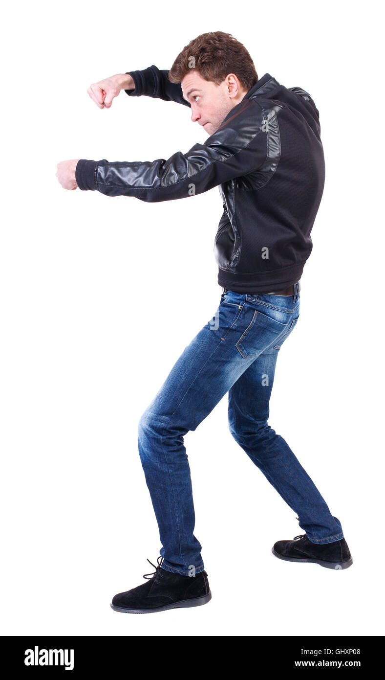 back view of guy funny fights waving his arms and legs Stock Photo - Alamy