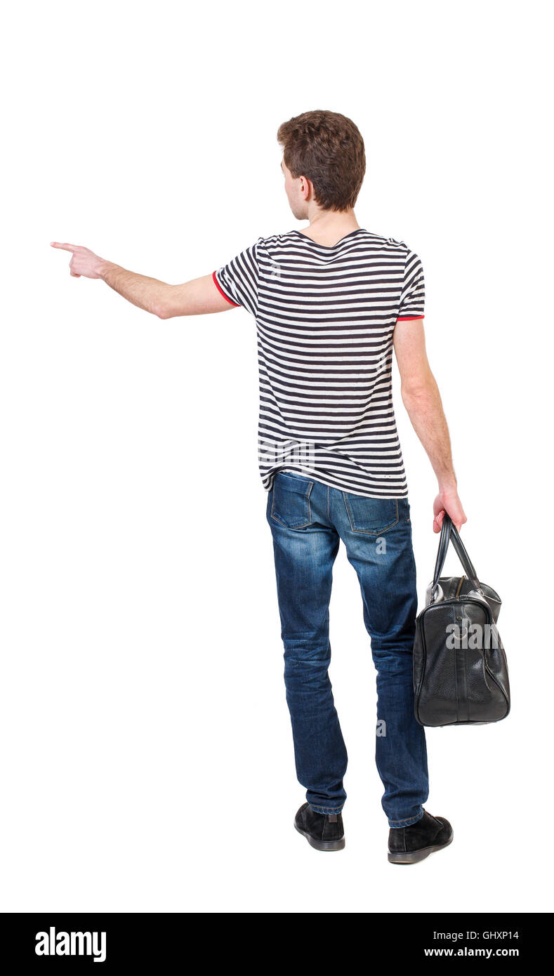 back view of pointing man with bag Stock Photo - Alamy