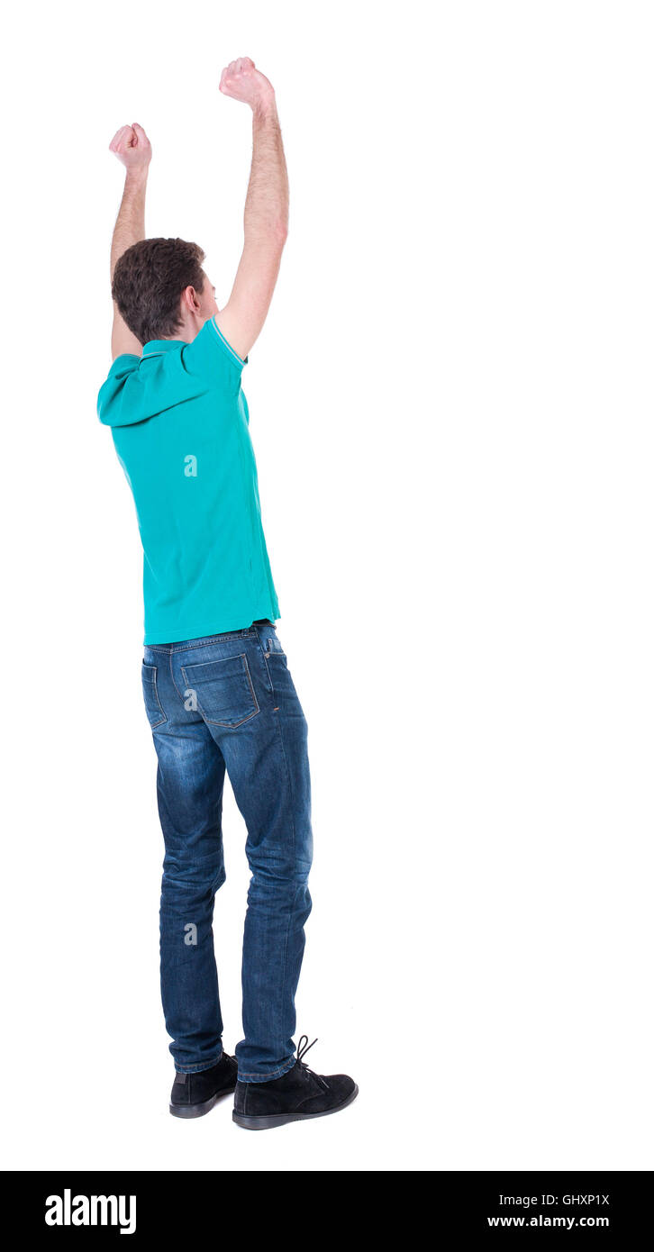 Back view of man. Raised his fist up in victory sign Stock Photo - Alamy
