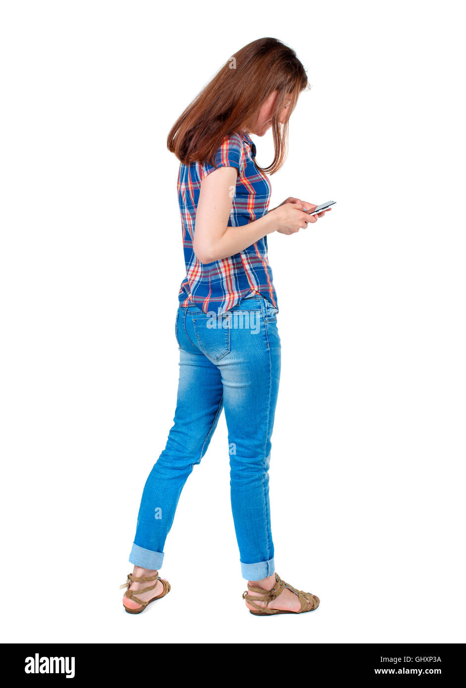 back view of standing young beautiful woman using a mobile phon Stock ...