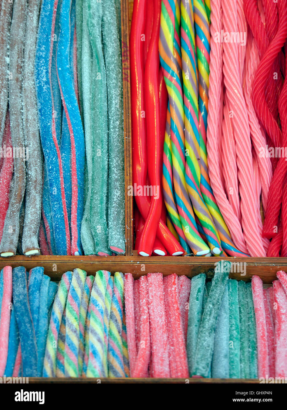 Colored strips of candy in a box, sweet and tasty Stock Photo - Alamy