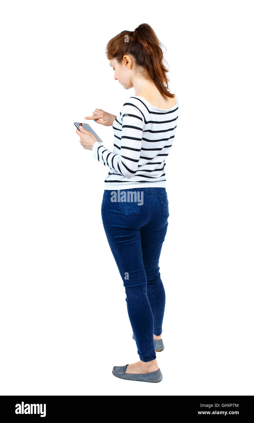 back view of standing young beautiful woman using a mobile phon Stock ...