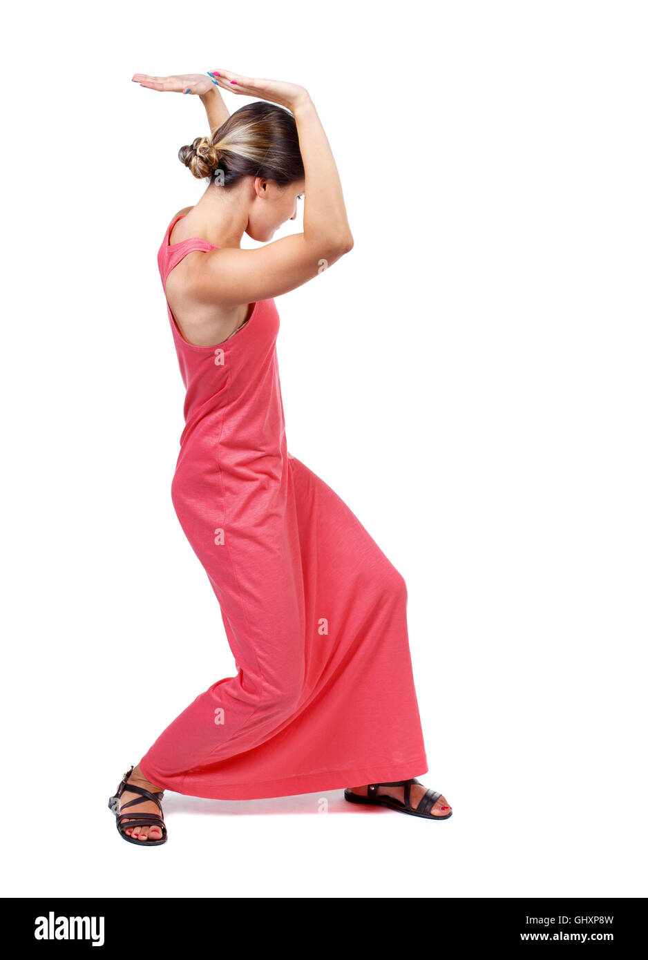 back view of woman protects hands from what is falling Stock Photo - Alamy