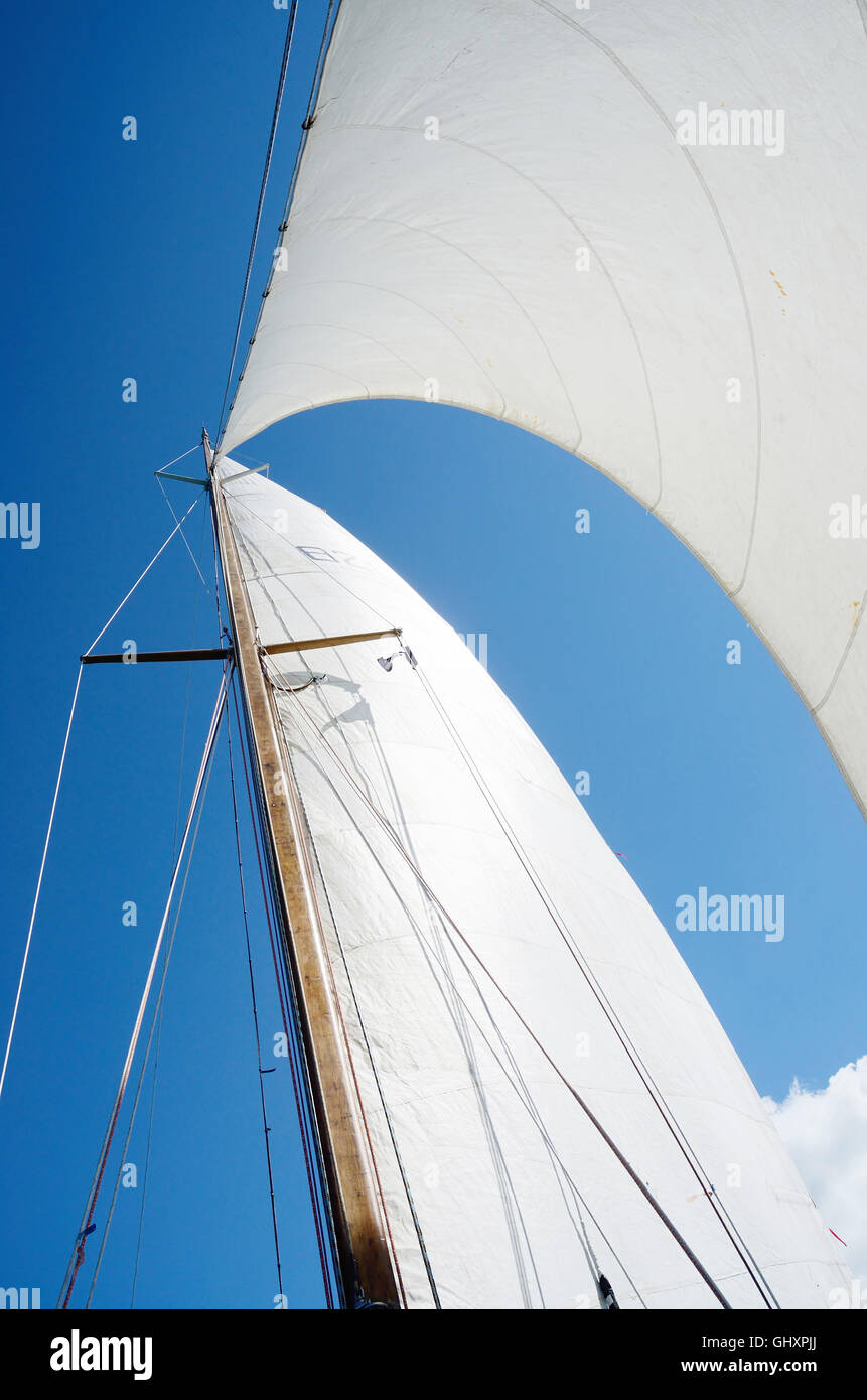 Sail and mast on yacht, view from deck of boat Stock Photo - Alamy