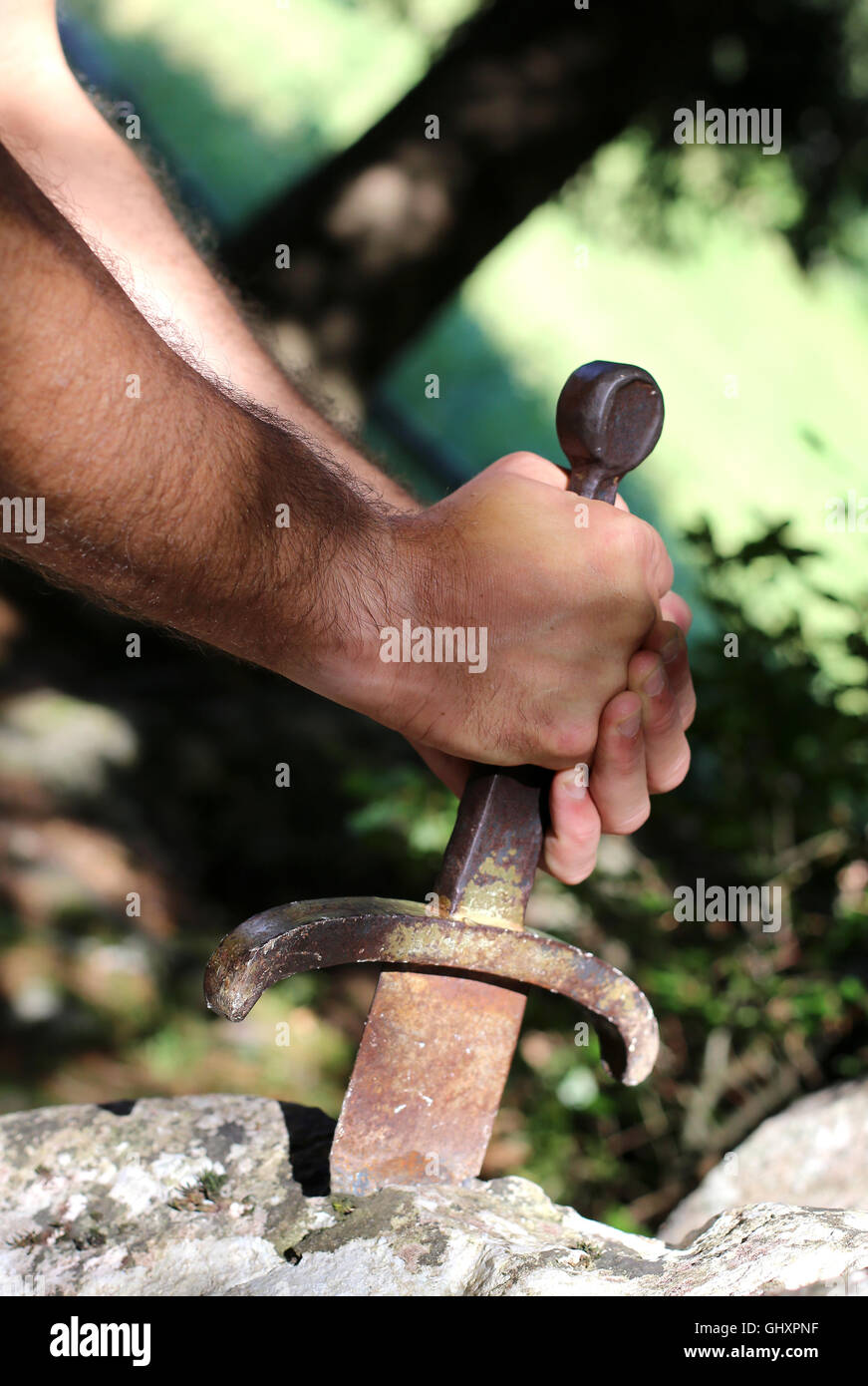 hand of a blockbuster Knight and the famous Excalibur sword in the ...