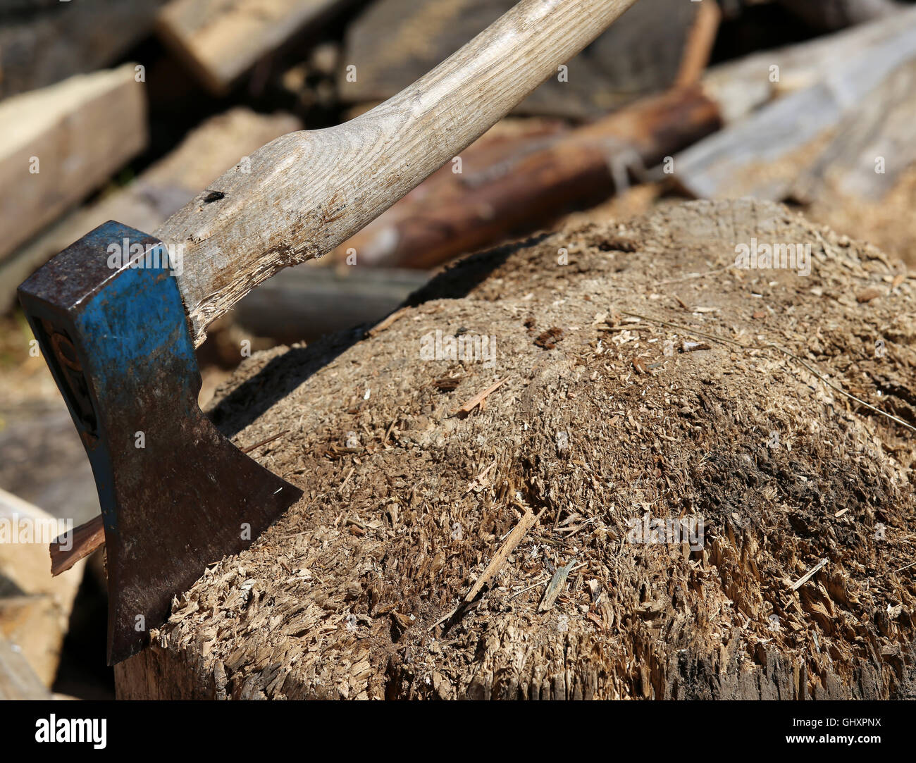 big ax of a woodcutter on the block of wood in the woodshed Stock Photo ...