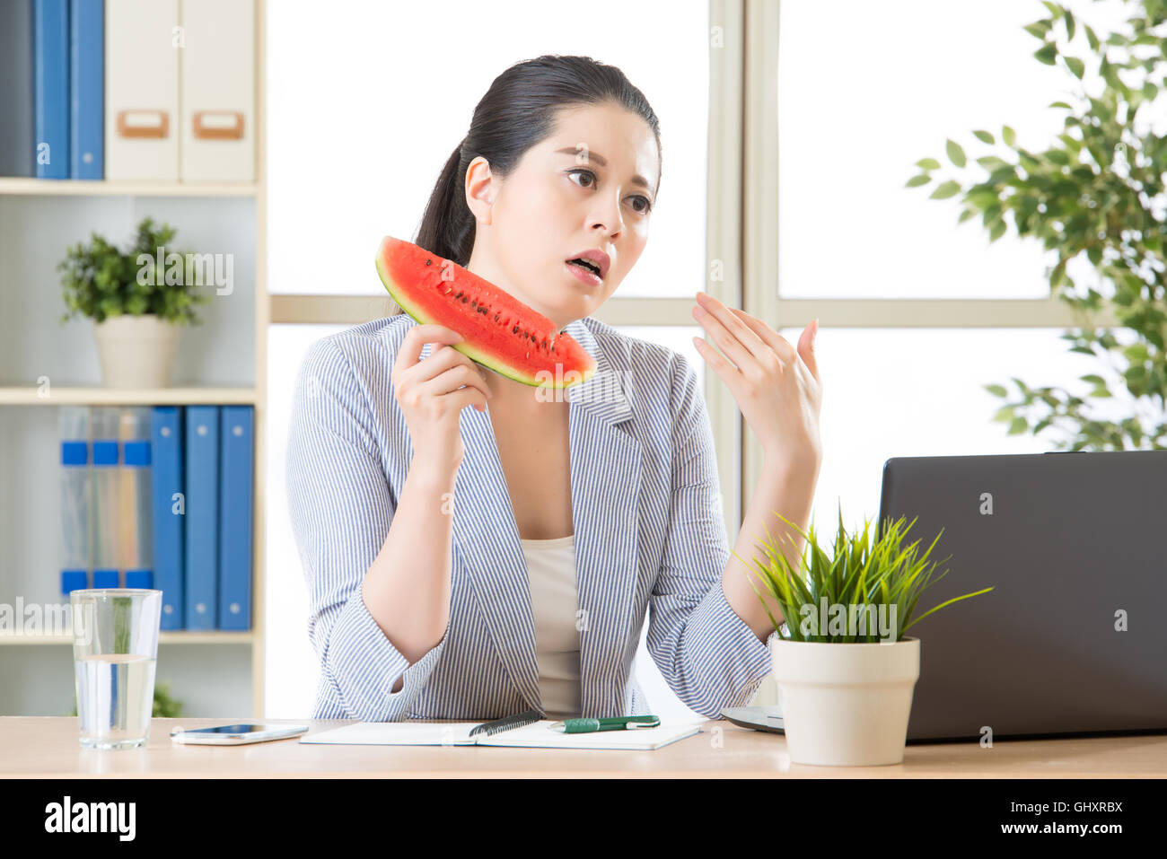 swing your hand making some wind and have watermelon fruit in office ...