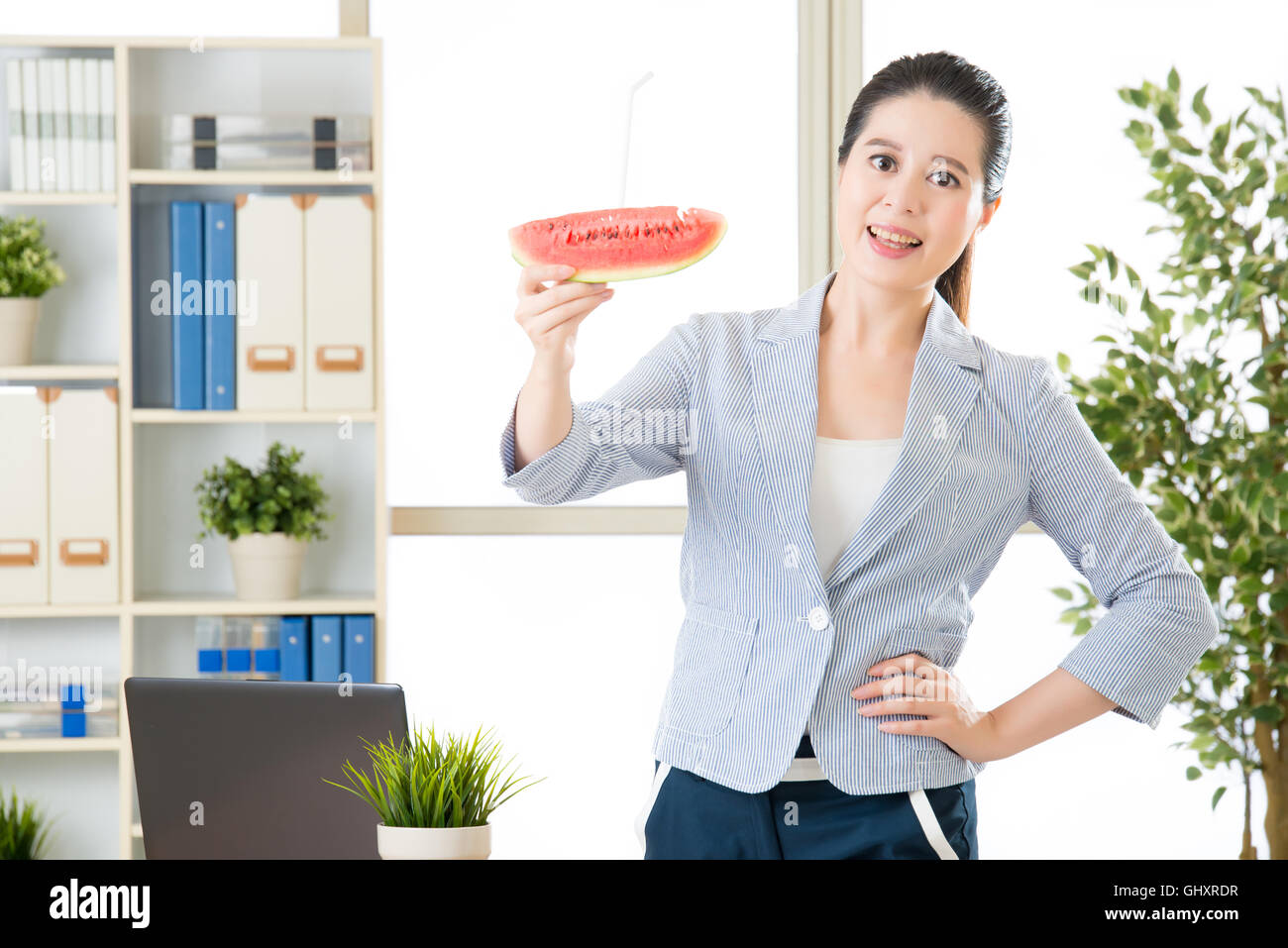 Cheerful woman biting watermelon hi-res stock photography and images ...