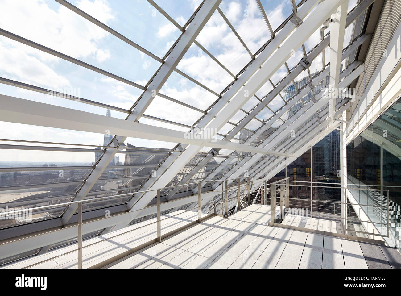 Balcony canopied by sloped roof glazing. 70 Mark Lane - City of London ...