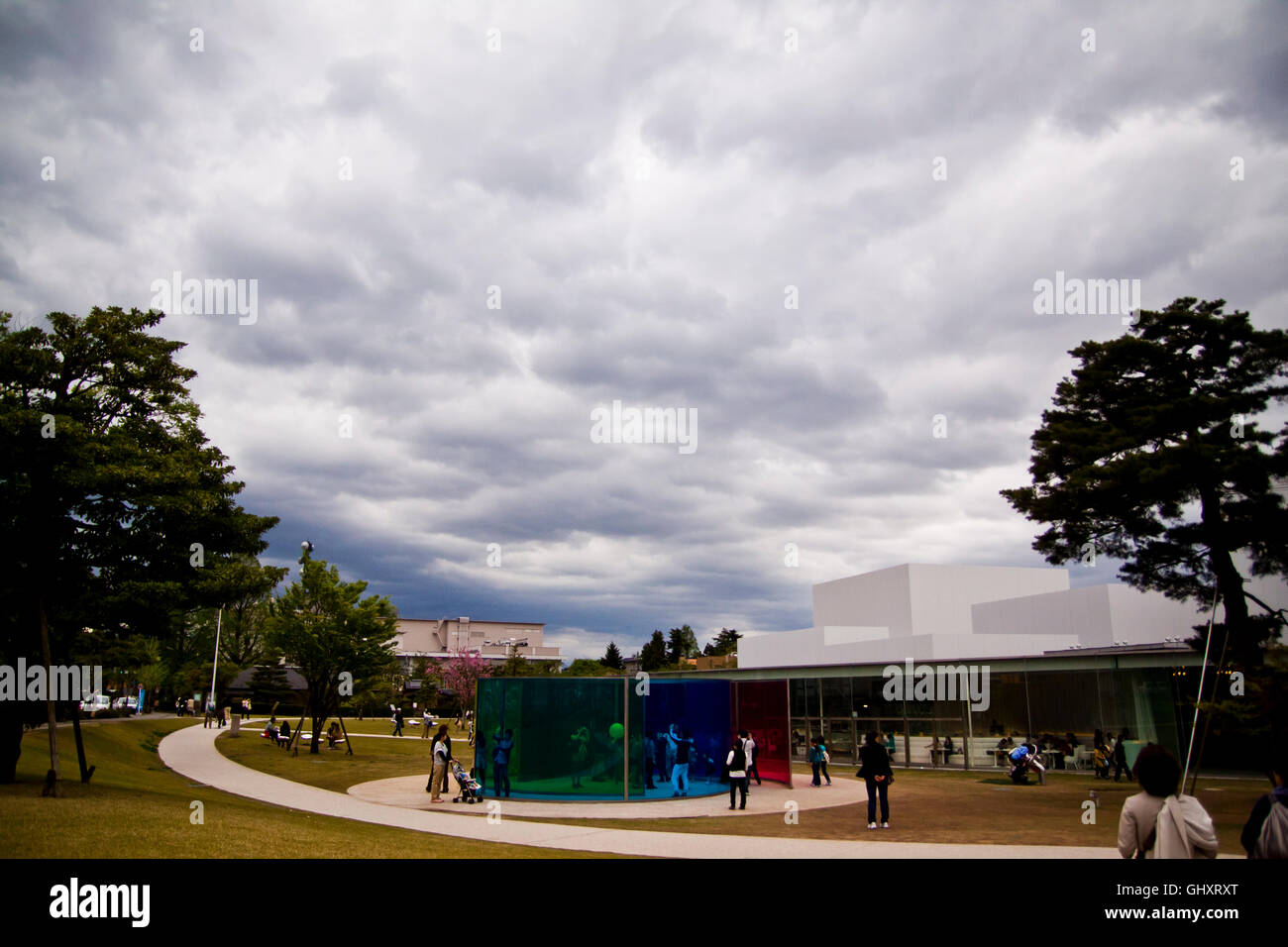Visitors walk through an installation of coloured glass at the museum ...