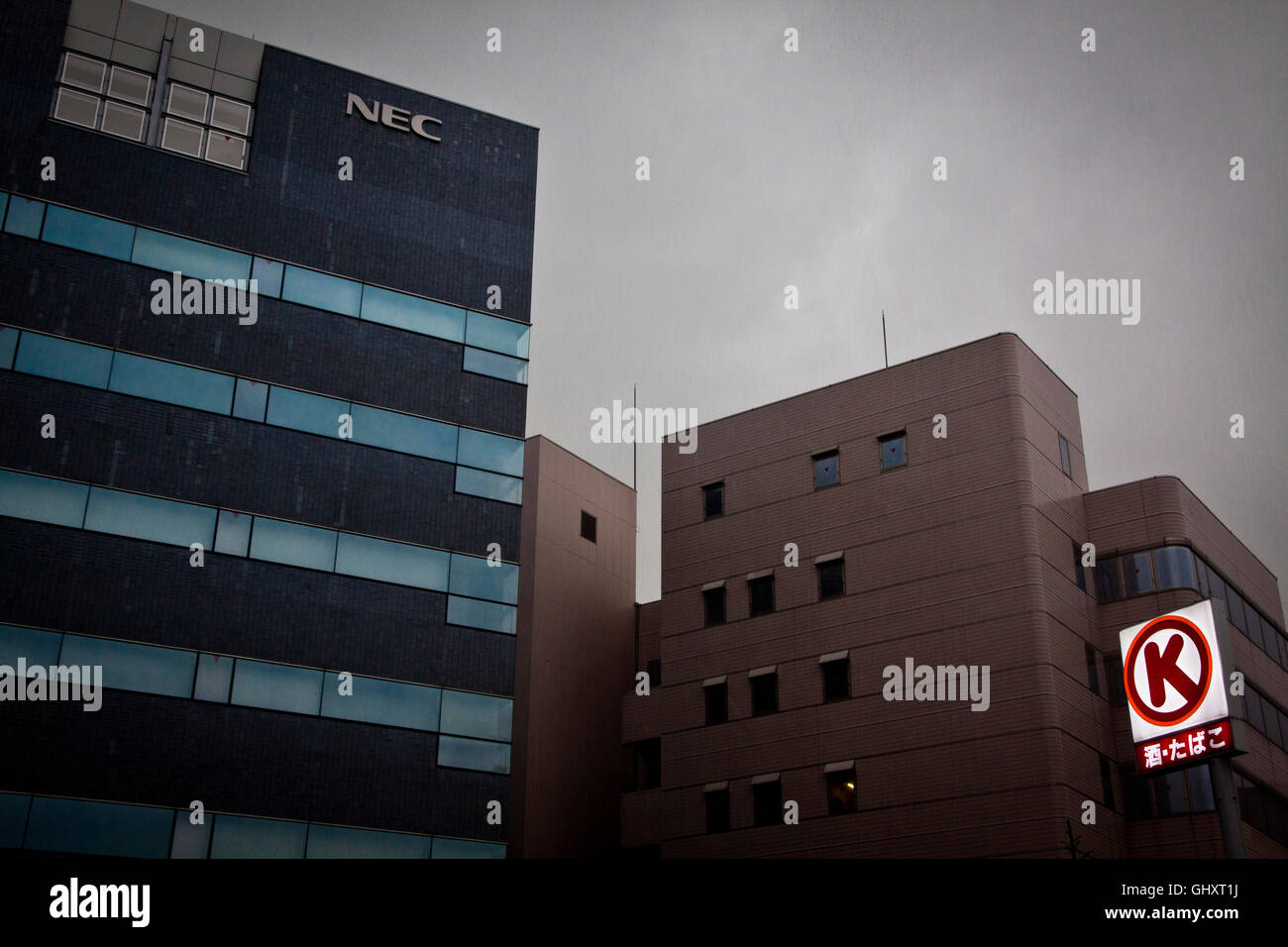 Neon sign of Circle K convenience store (combini) under gloomy skies, Kanazawa, Japan Stock ...