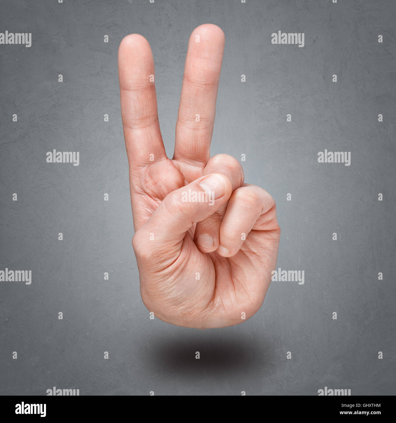 Hand gesture of victory and peace Stock Photo - Alamy