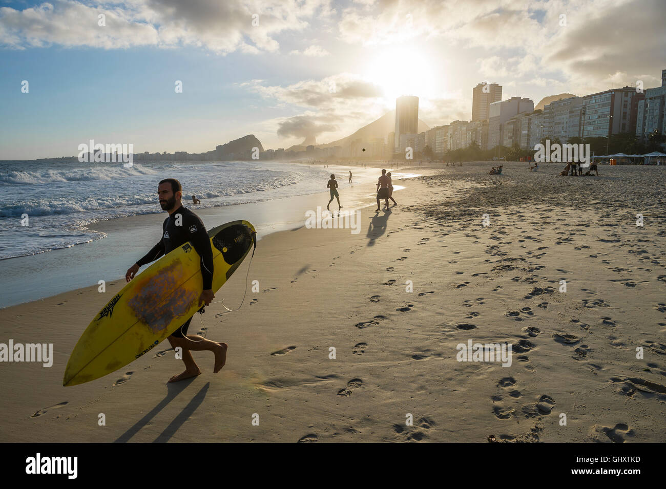RIO DE JANEIRO - OCTOBER 30, 2015: A Brazilian surfer heads to the sea ...