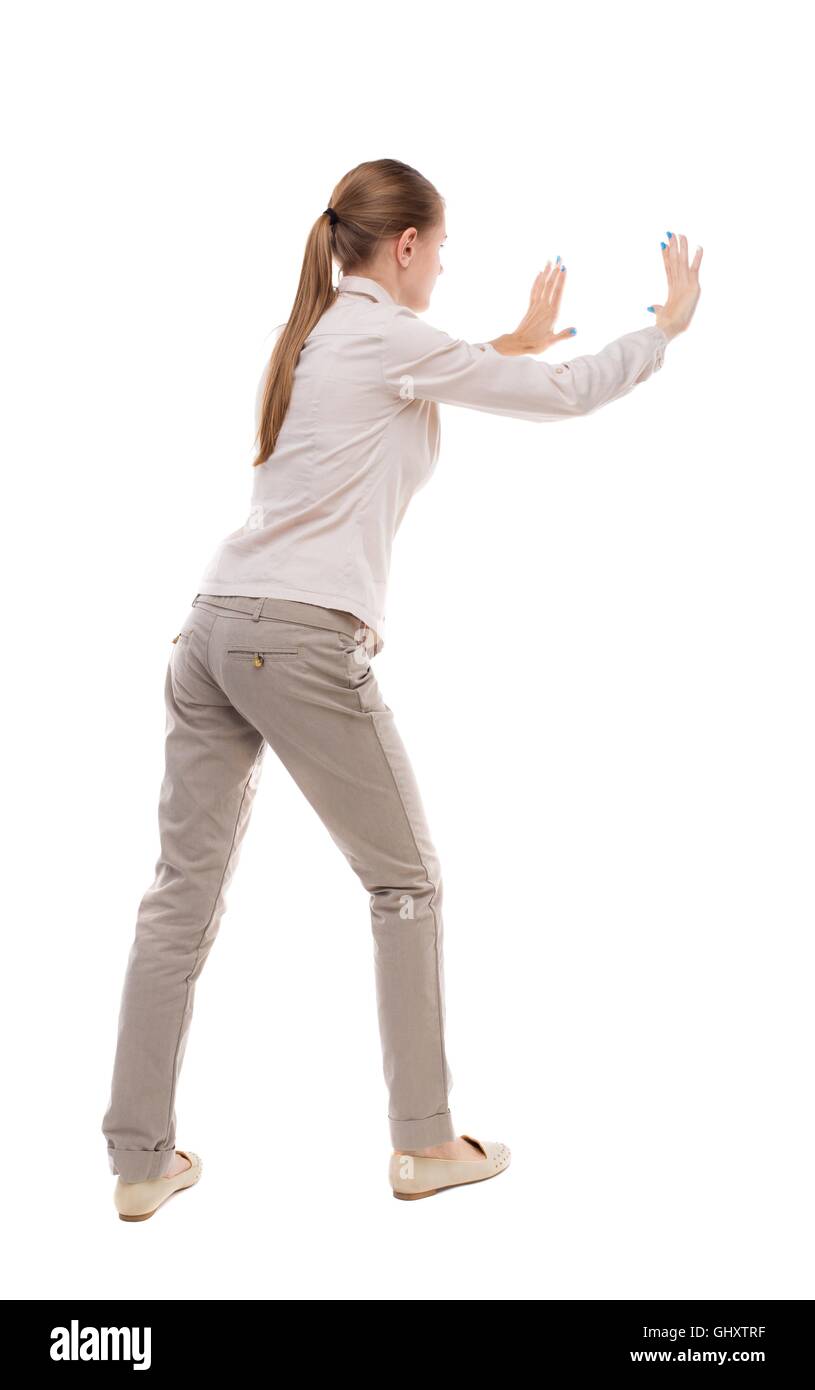 back view of woman pushes wall Stock Photo - Alamy
