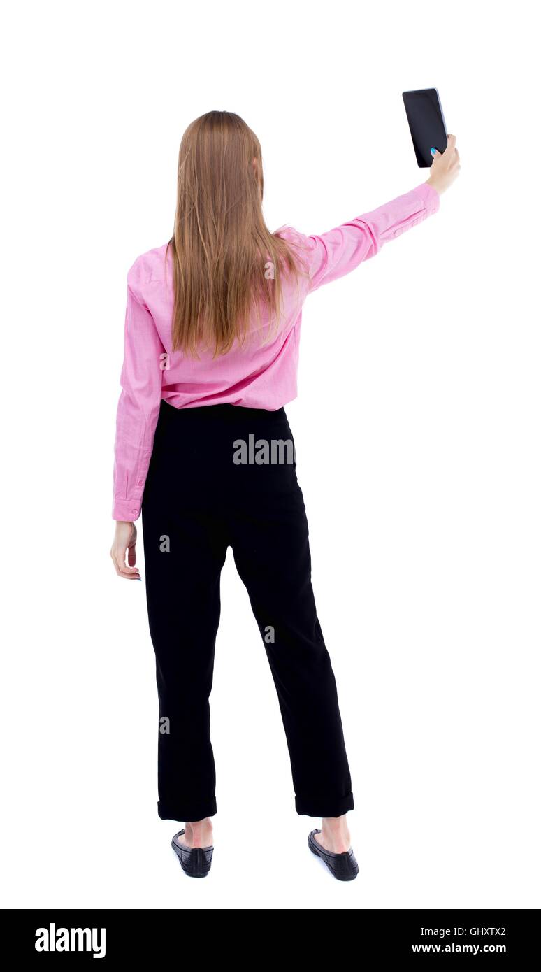 back view of standing young beautiful girl with tablet computer Stock ...