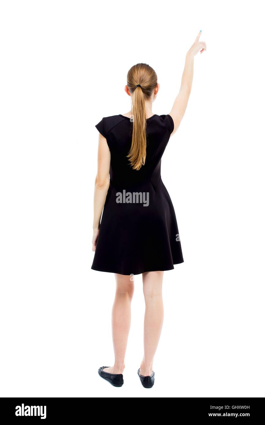 Back view of pointing woman Stock Photo - Alamy