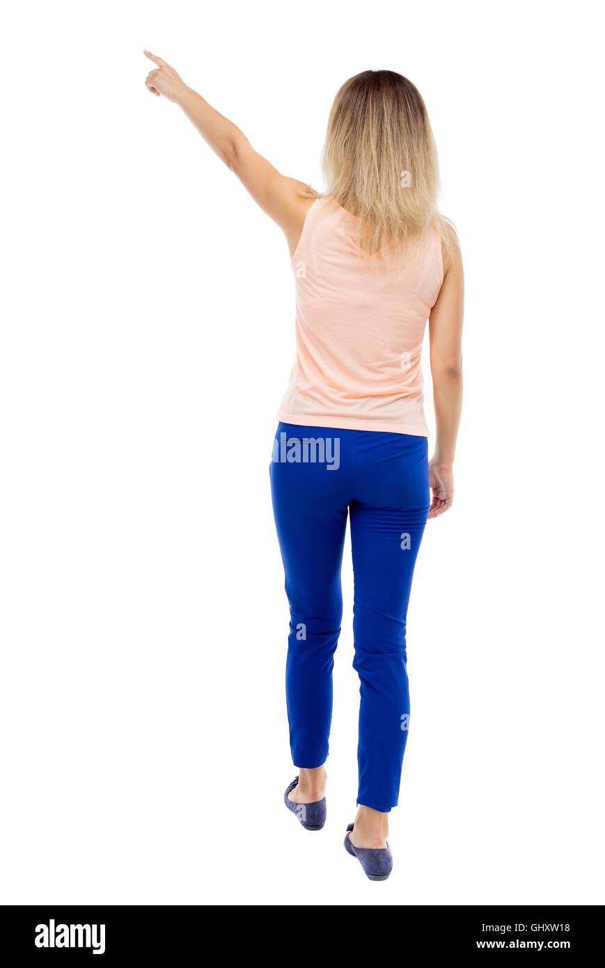 Back view of pointing woman Stock Photo - Alamy