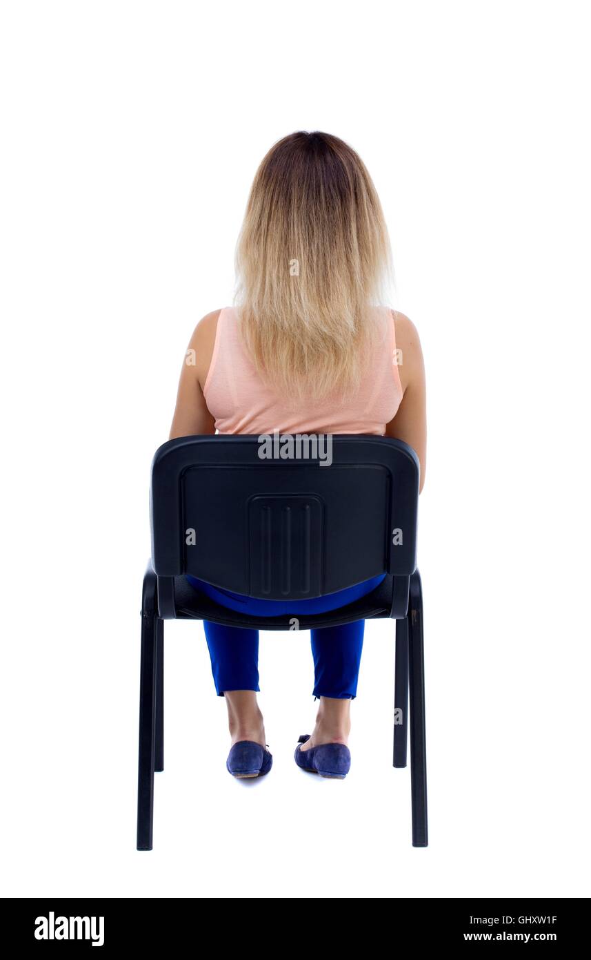 back view of young beautiful woman sitting on chair Stock Photo - Alamy