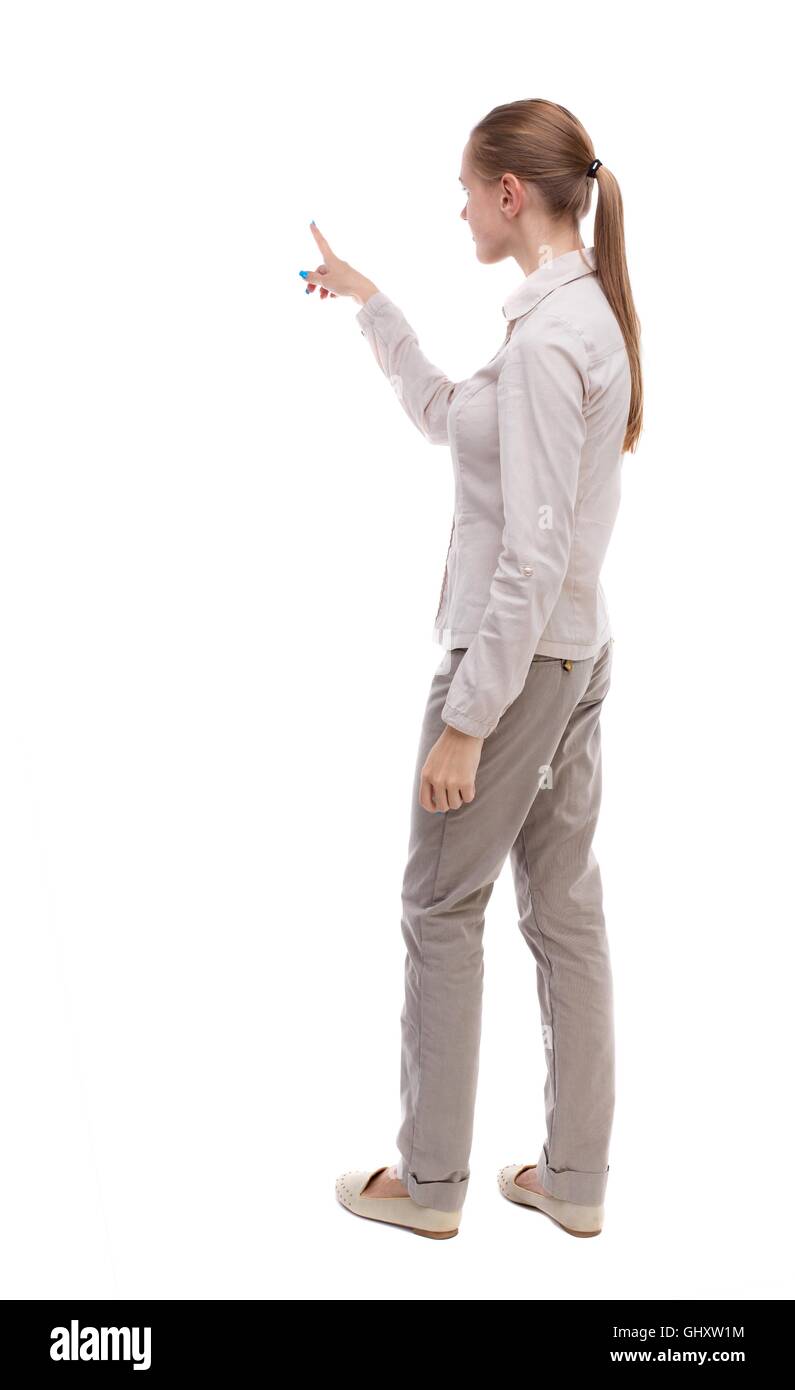 Back view of pointing woman Stock Photo - Alamy