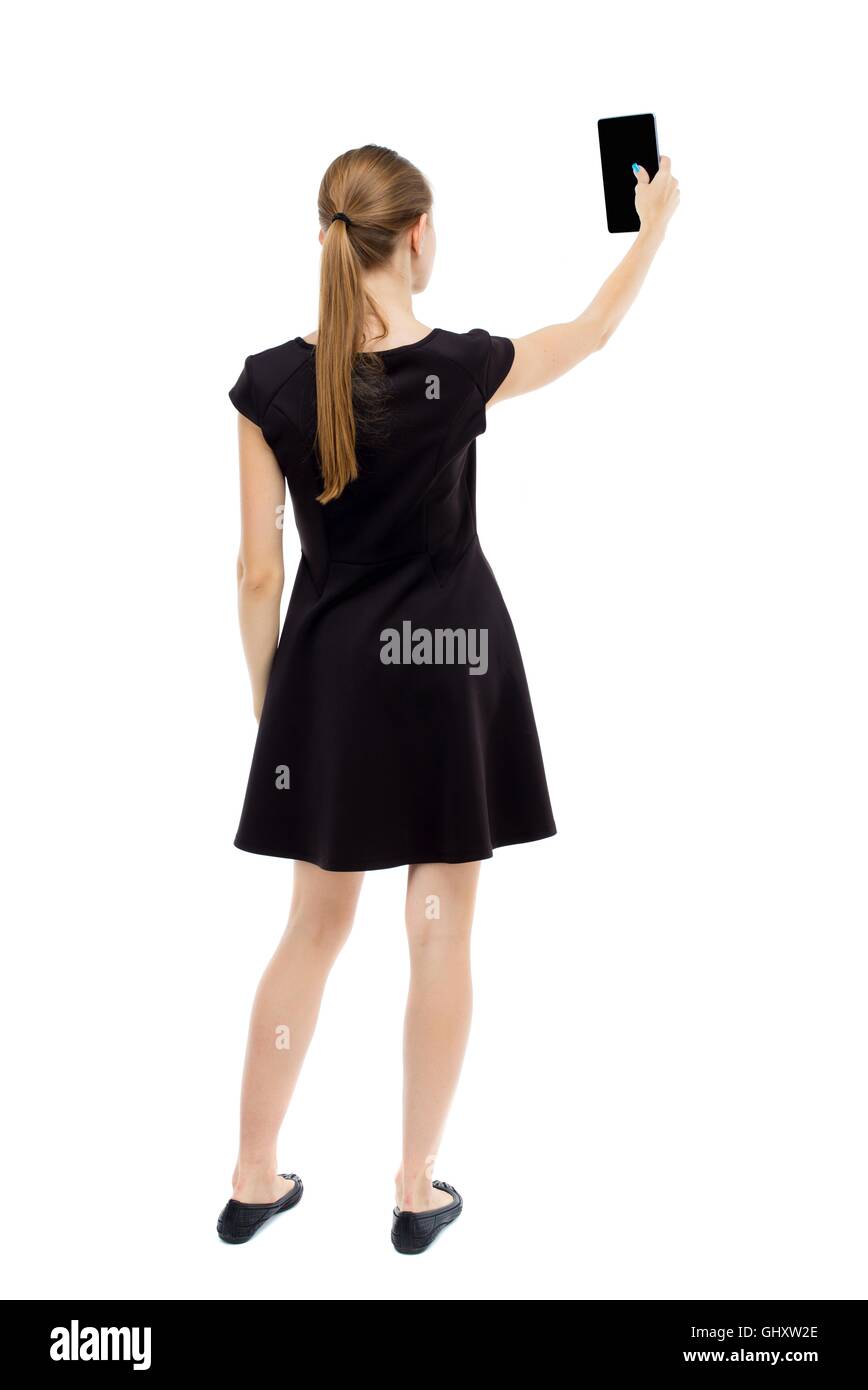 back view of standing young beautiful girl with tablet computer Stock ...