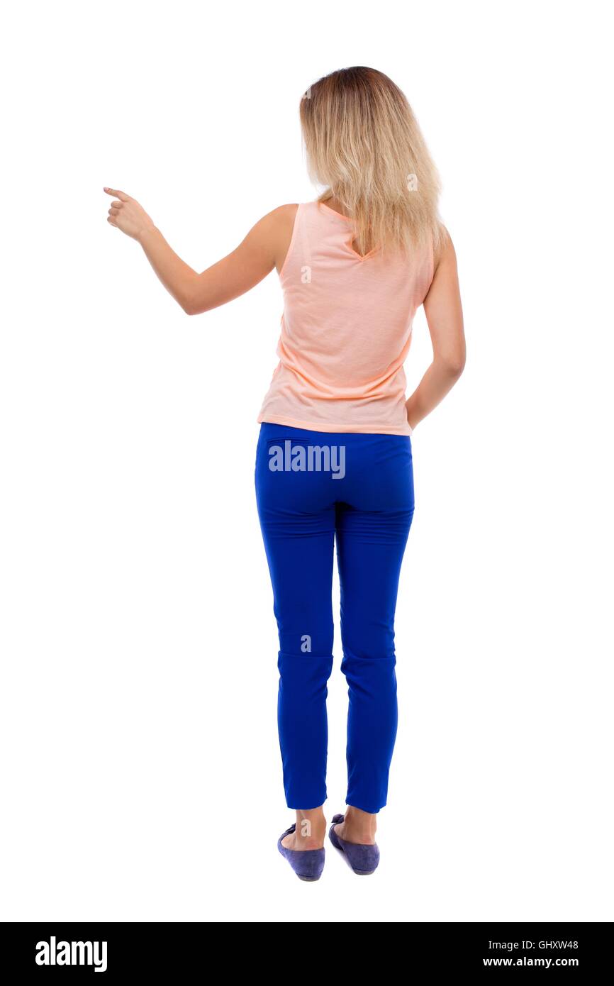 Back view of pointing woman Stock Photo - Alamy