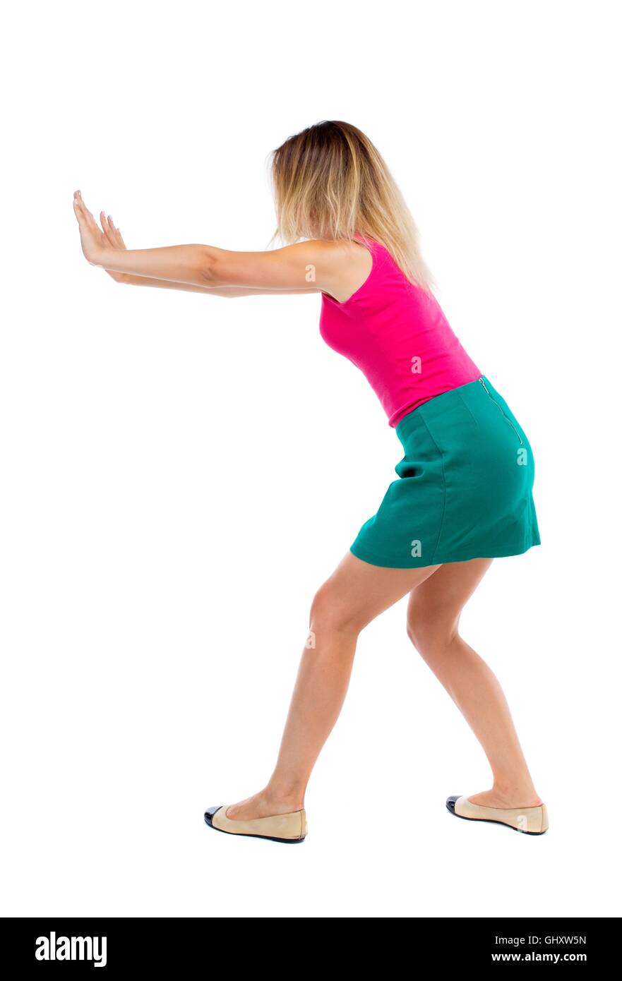 back view of woman pushes wall Stock Photo - Alamy