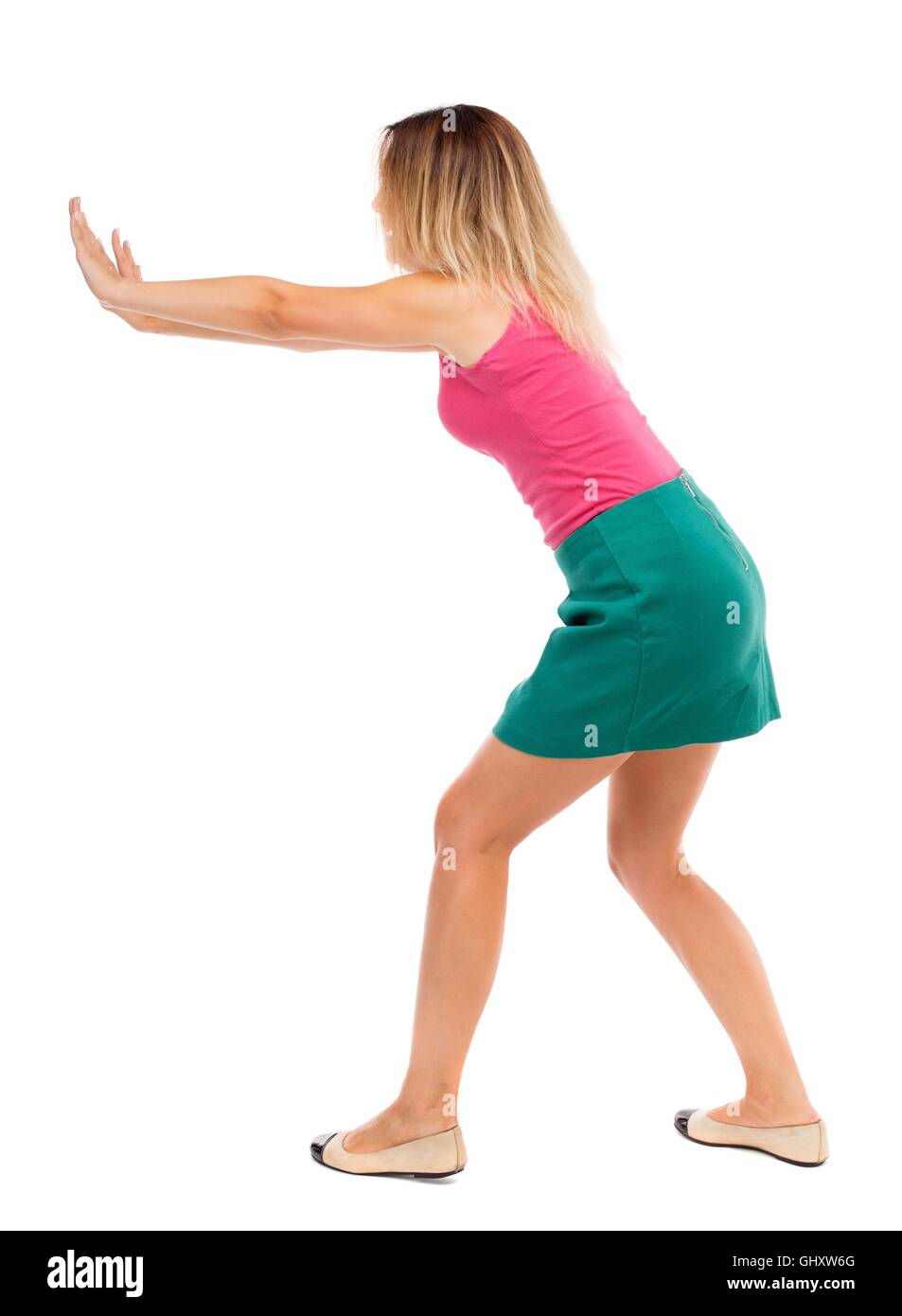 back view of woman pushes wall Stock Photo - Alamy