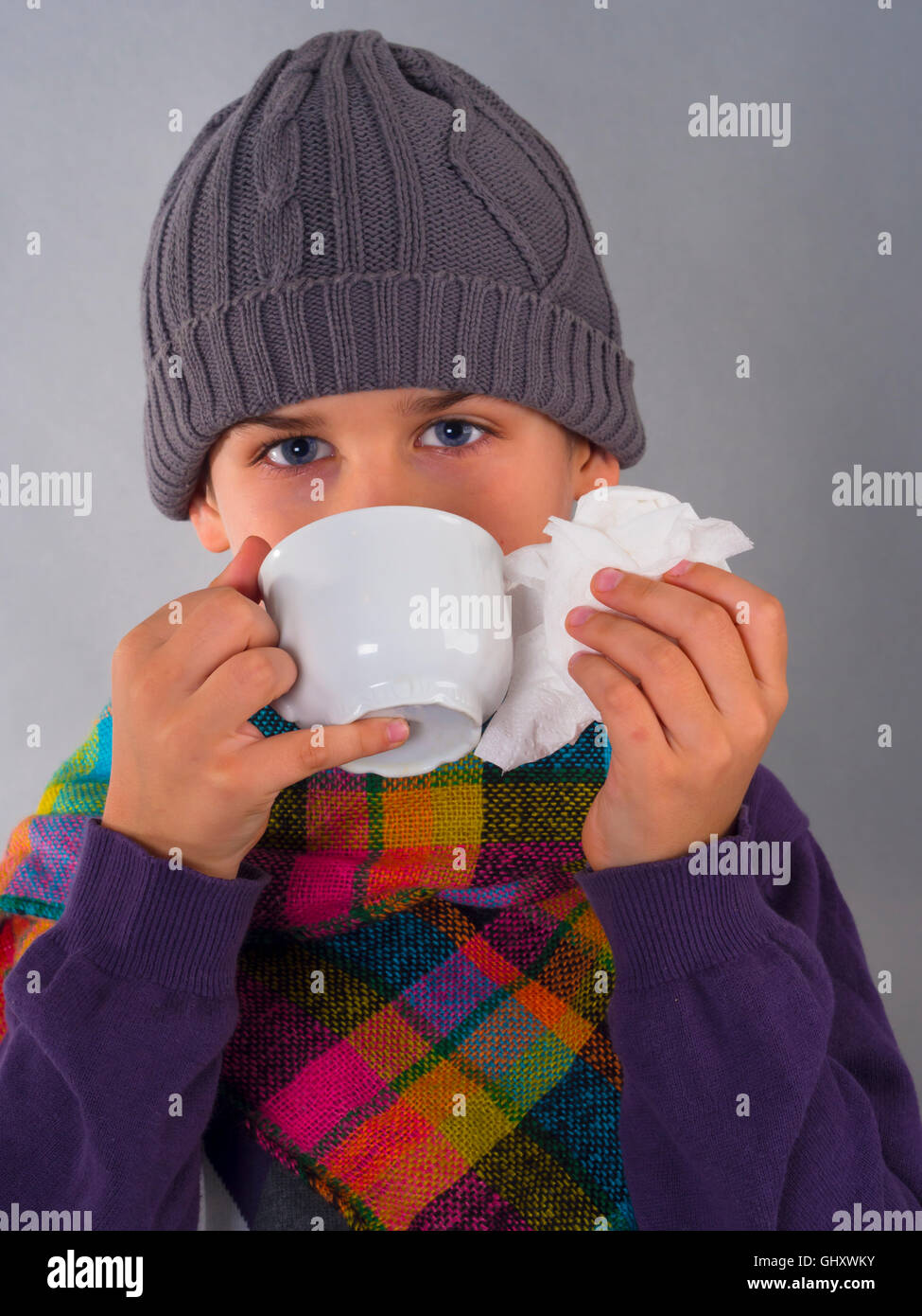 boy in the winter clothes, cold, ill Stock Photo - Alamy