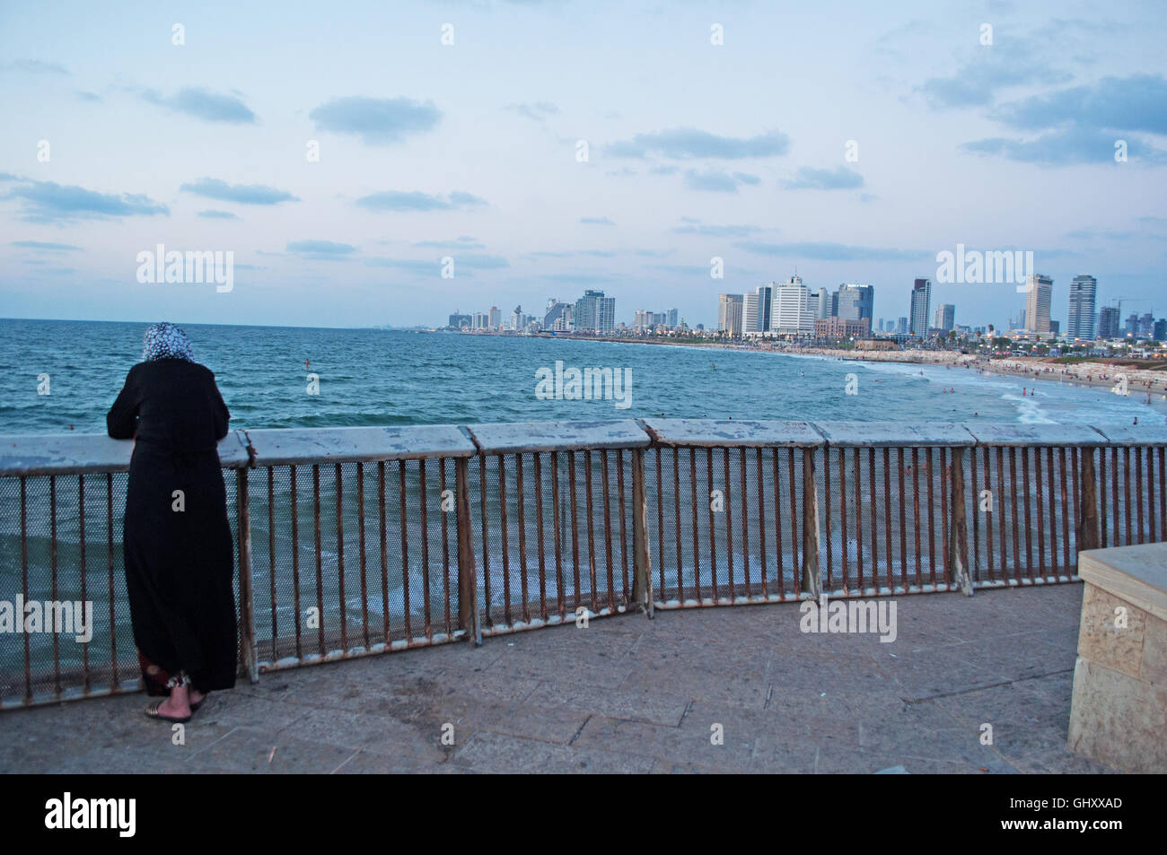 Israel, Middle East: a muslim woman at the promenade of Jaffa after the ...