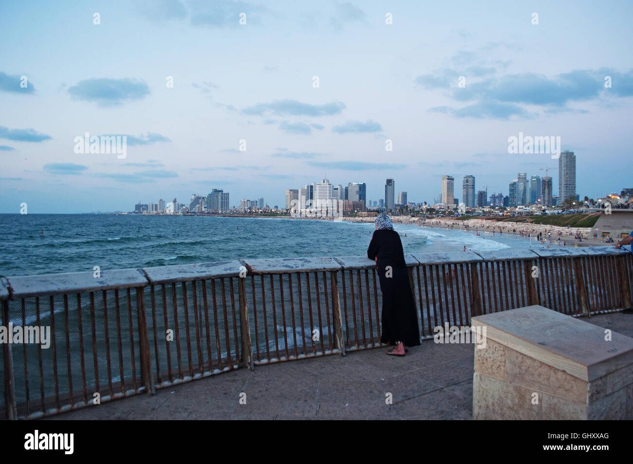 Israel, Middle East: a muslim woman at the promenade of Jaffa after the ...