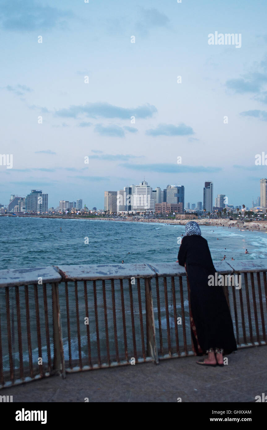 Israel, Middle East: a muslim woman at the promenade of Jaffa after the ...