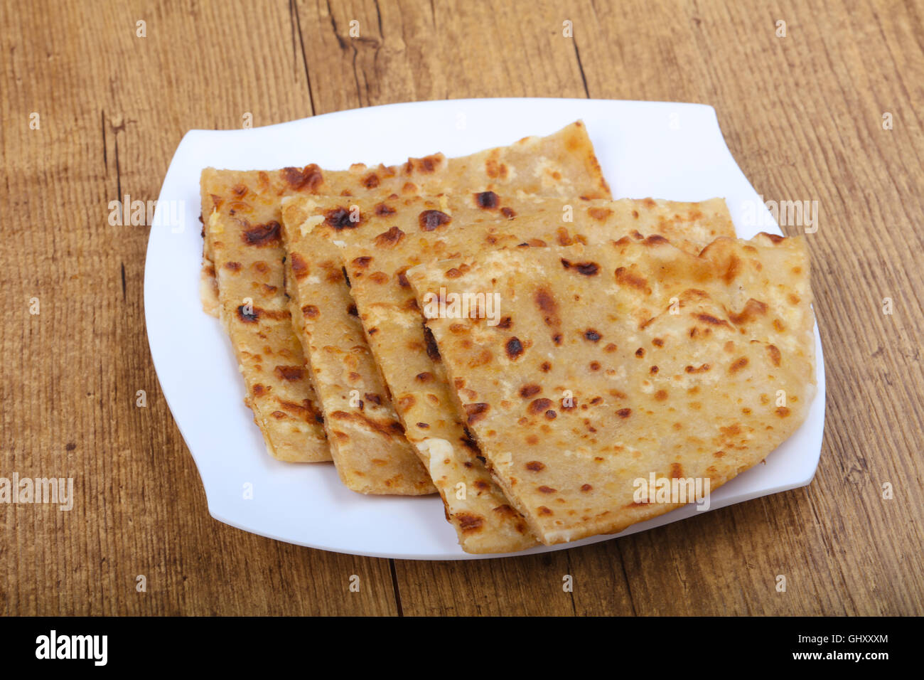 Indian bread roti on the plate in wood background Stock Photo - Alamy