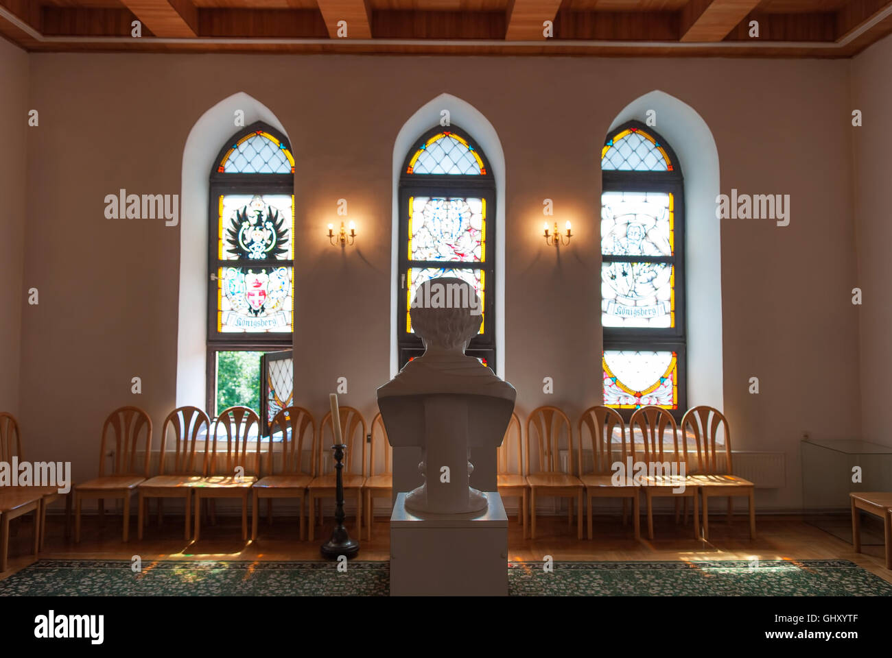 Bust in front of stained-glass windows Stock Photo - Alamy