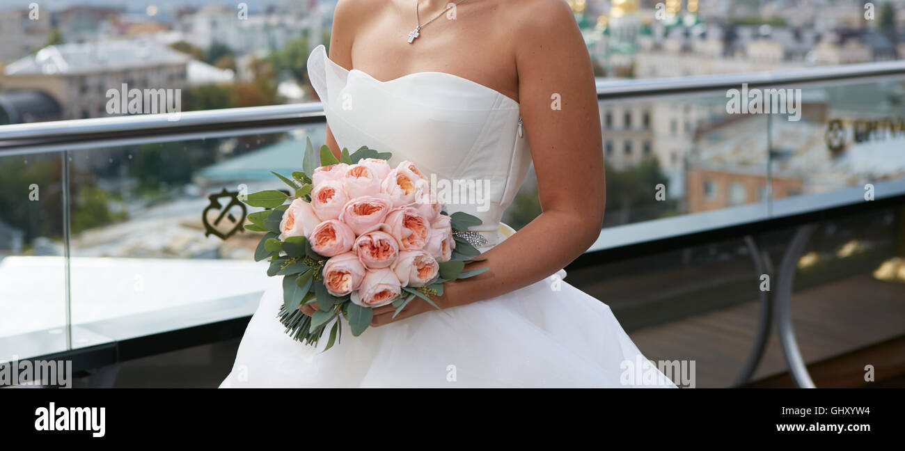 Bride holding big wedding bouquet on wedding ceremony Stock Photo - Alamy