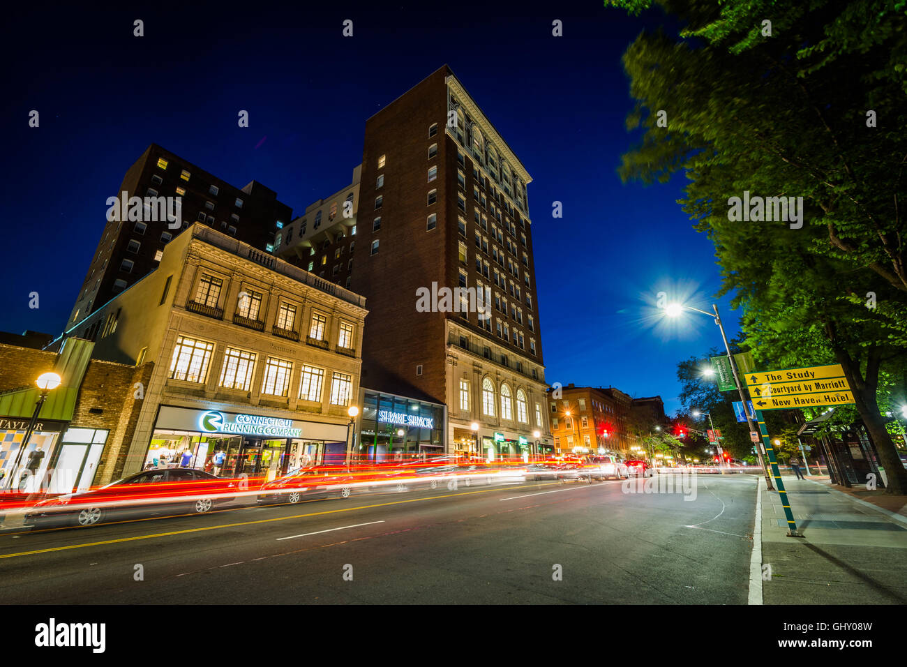 Buildings and traffic on Chapel Street at night, in downtown New Haven ...