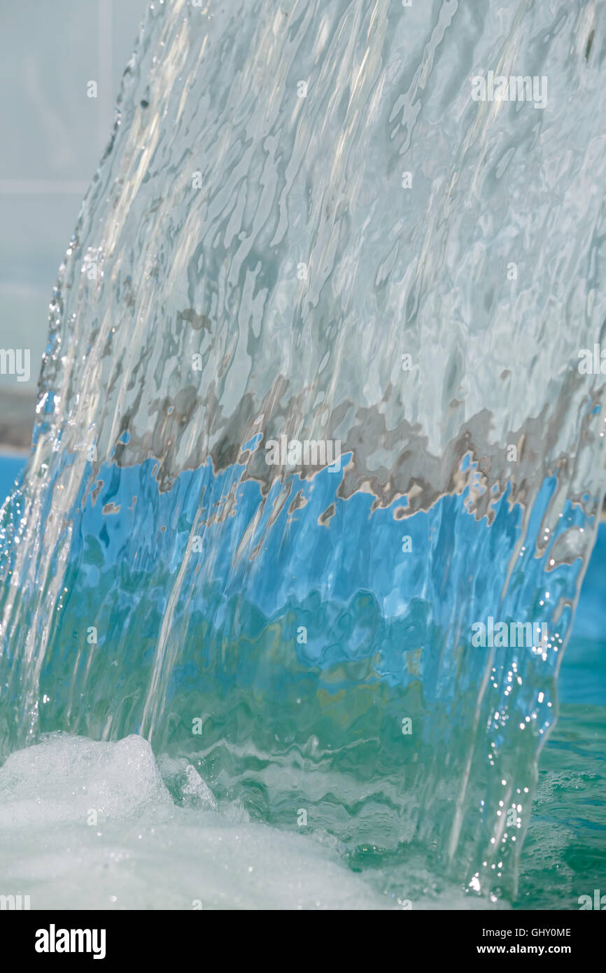 A continuous flow of water flows in the pool Stock Photo - Alamy