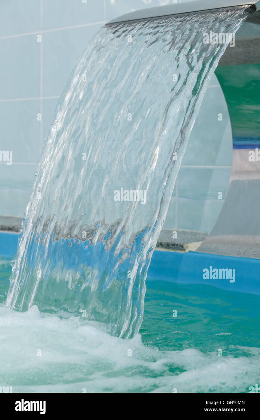 A continuous flow of water flows in the pool Stock Photo - Alamy