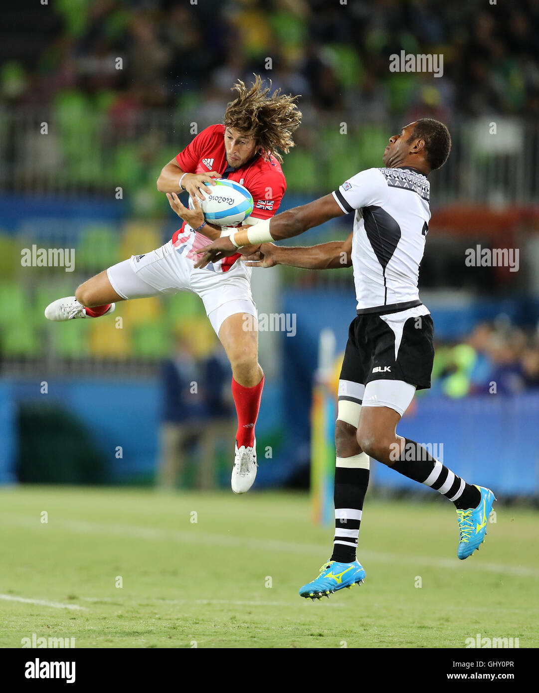 Great Britain's Daniel Bibby (left) and Fiji's Jasa Veremalua in action during the Rugby Sevens ...