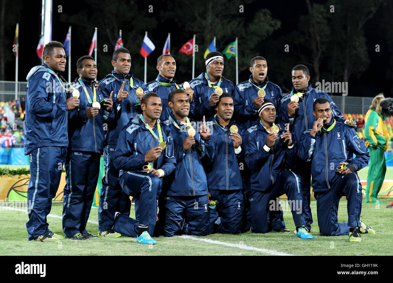 Players from Fiji with their gold medals after winning the Rugby Sevens ...